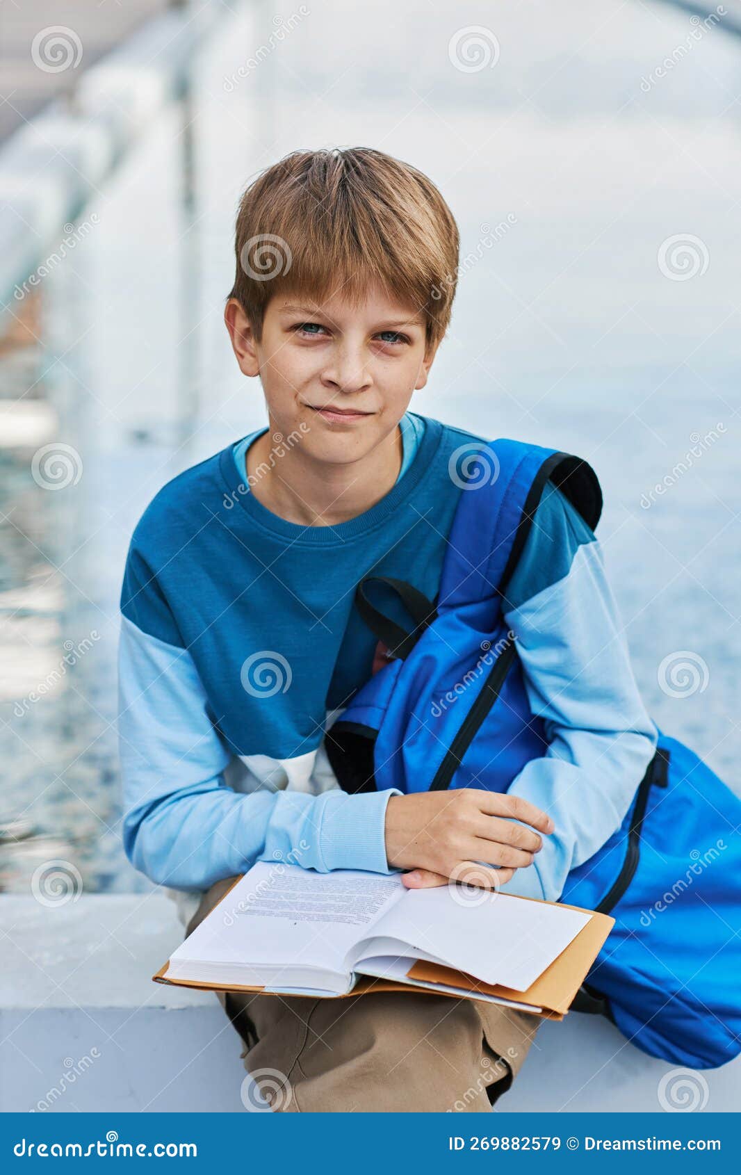 Cute Secondary School Learner with Open Book Looking at Camera Stock ...