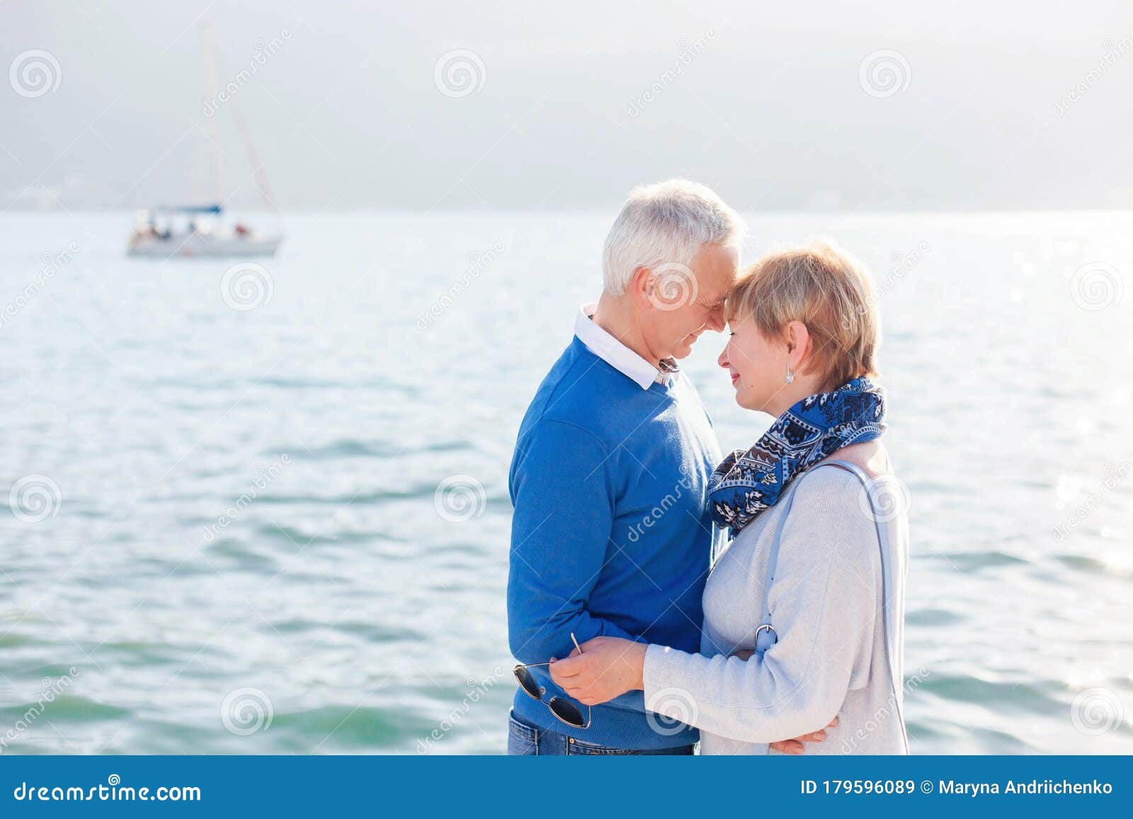Cute Senior Couple Is Hugging And Embracing At Sea Beach Outdoor Happy