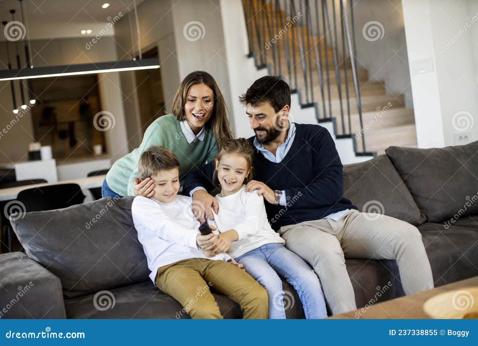 Siblings Fighting Over TV Remote Control at Home Stock Image - Image of ...