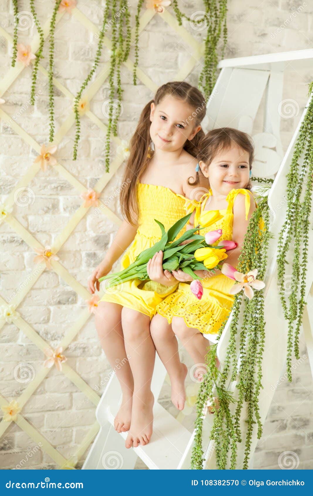 Cute Little Girls in Spring Studio Stock Photo - Image of pink, bouquet ...