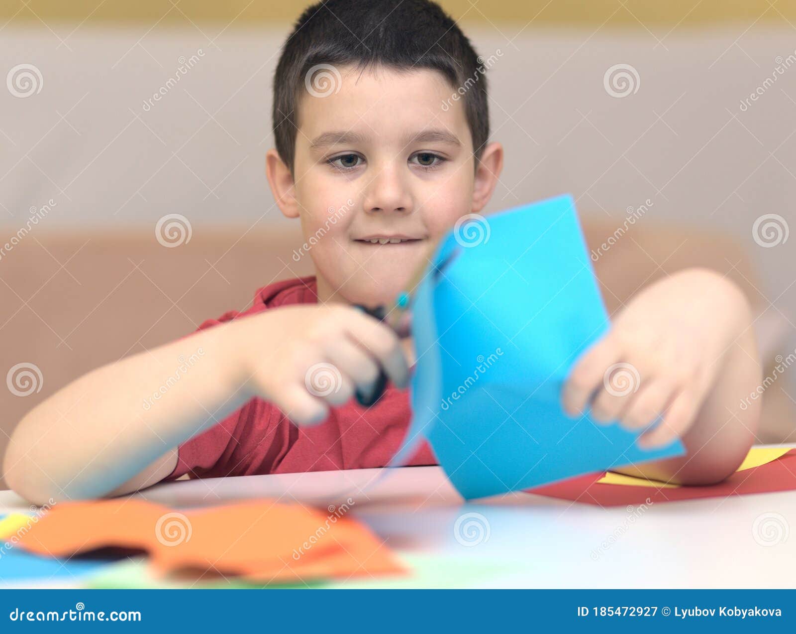 Cute Smiling Boy is Cutting Paper Using Scissors Stock Image - Image of ...