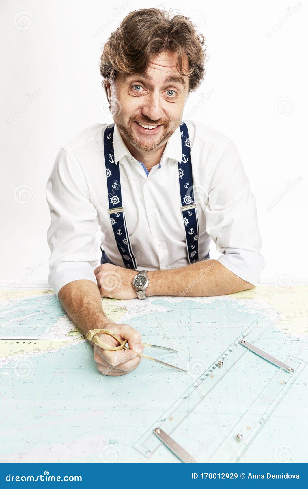 A Cute Smiling Captain Measures the Distance on a Map with a Compass ...