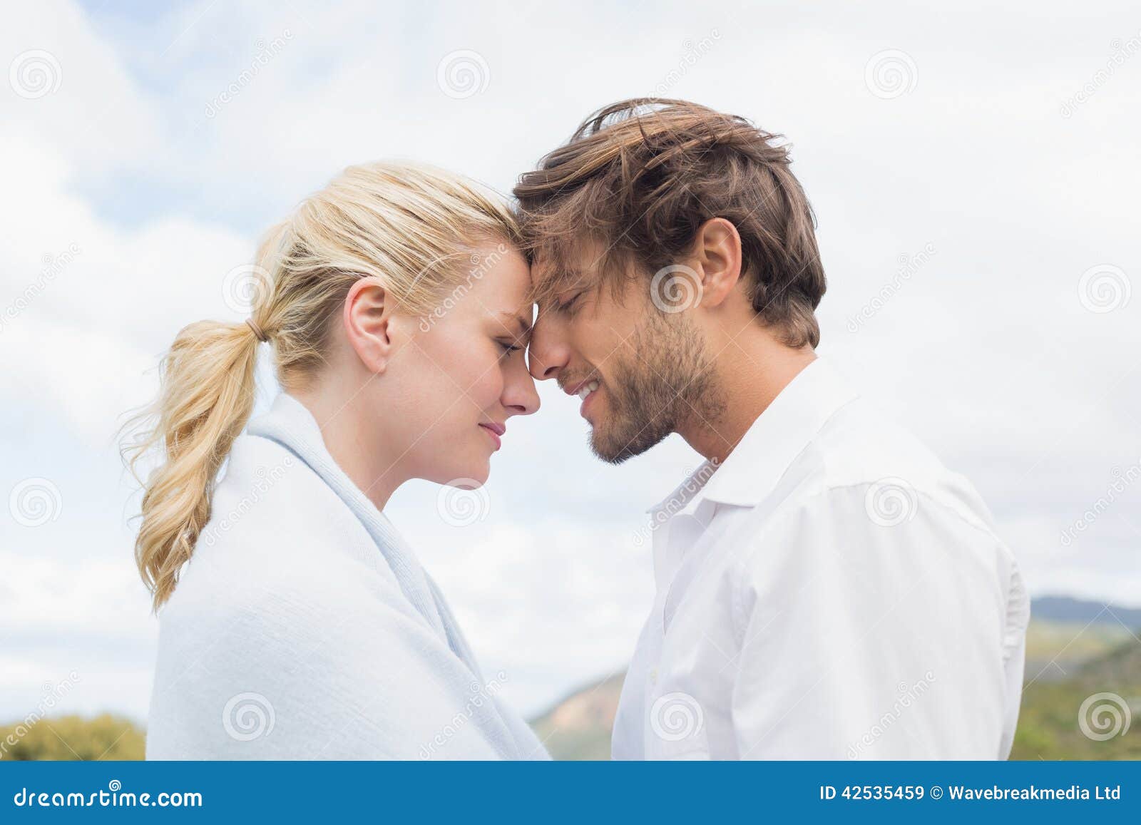 Cute Smiling Couple Standing Outside Facing Each Other Stock Image ...