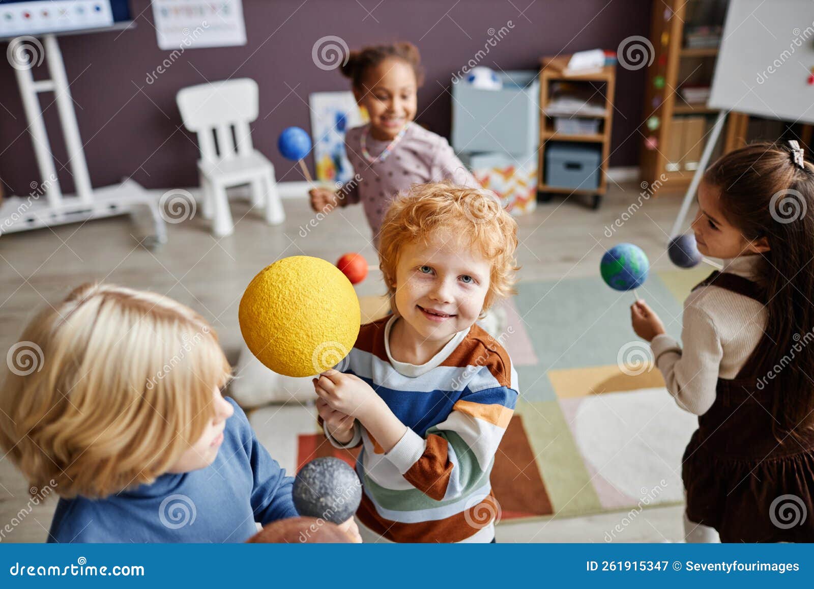 Cute Smiling Primary School Learner with Model of Sun Stock Image ...