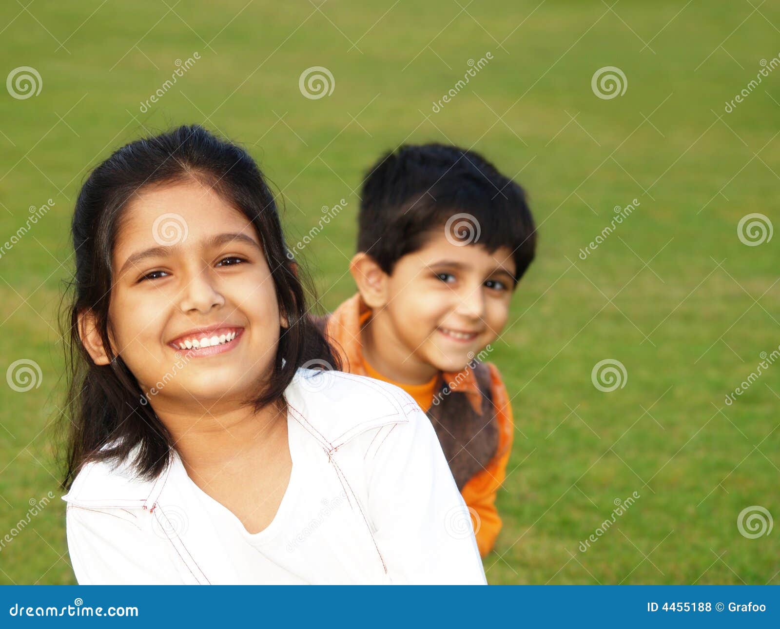 Cute smiling sisters stock photo. Image of lawn, outdoors - 4455188