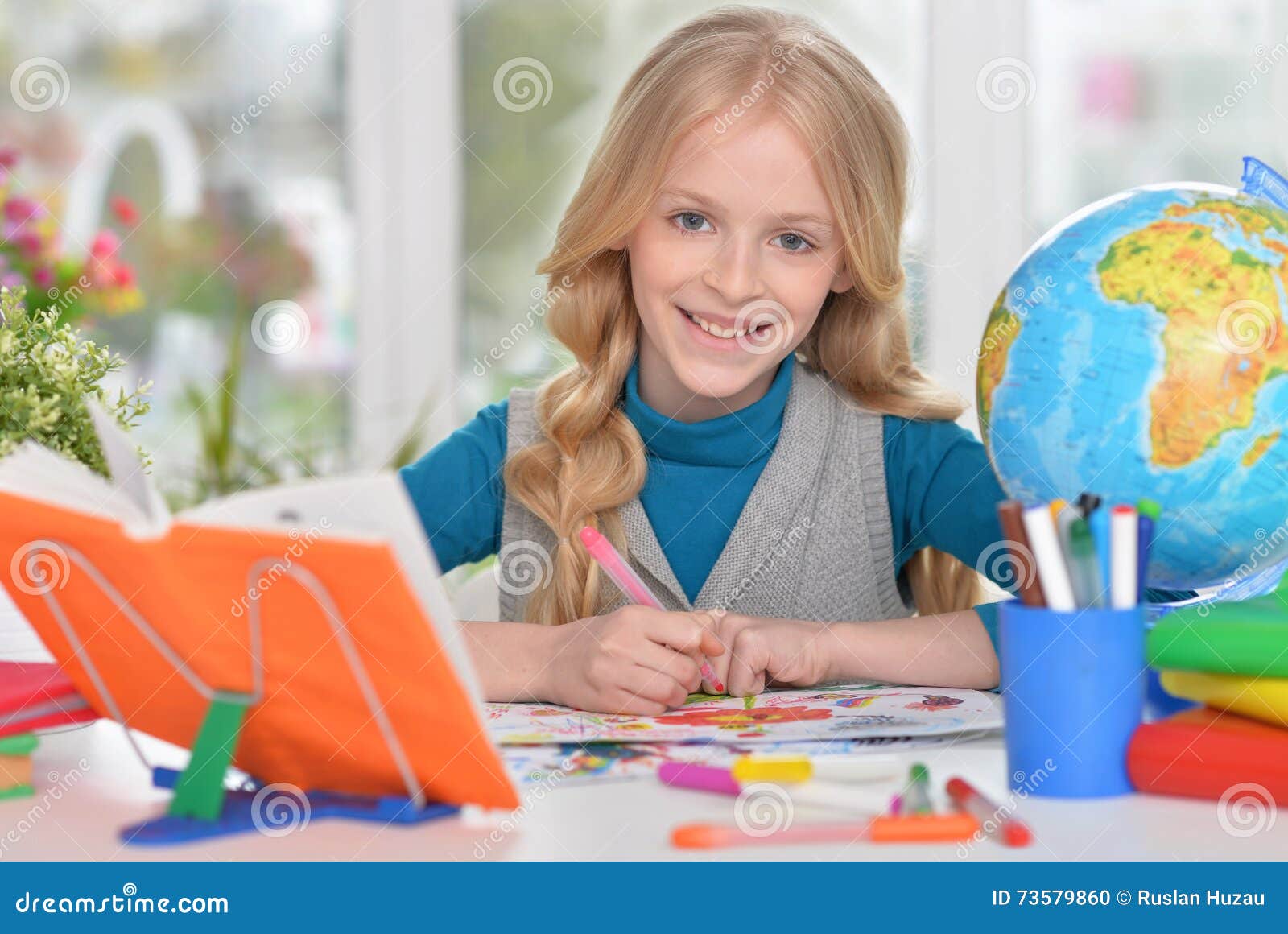 Cute student girl at class stock photo. Image of book - 73579860