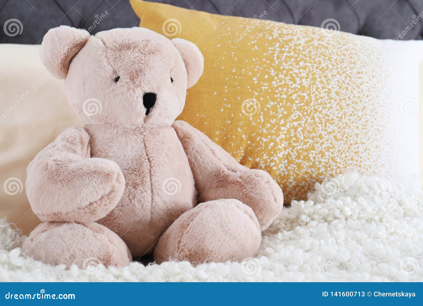 Cute Teddy Bear Sitting on Bed Indoors. Stock Image - Image of copy ...