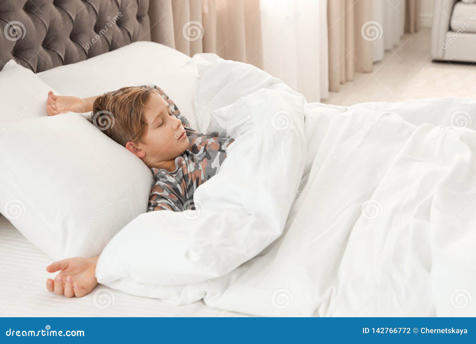 Cute tired boy sleeping stock photo. Image of dream - 142766772