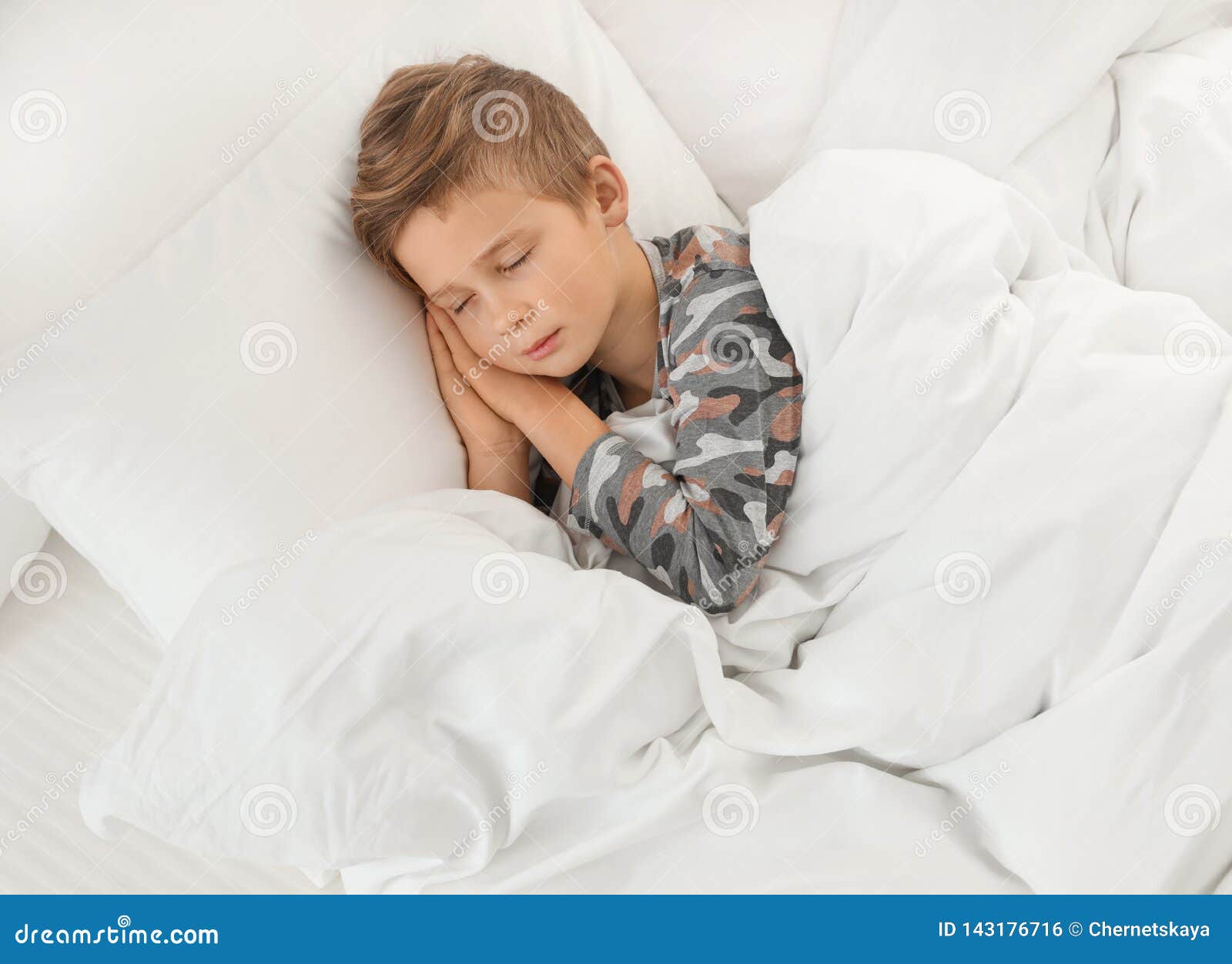 Cute tired boy sleeping stock photo. Image of carefree - 143176716