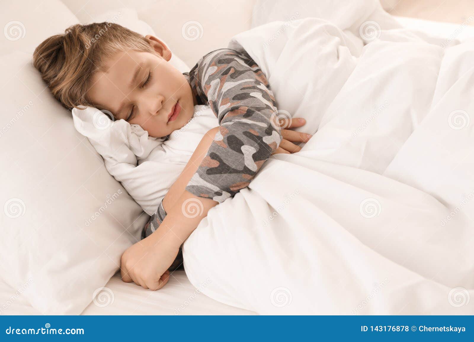 Cute tired boy sleeping stock photo. Image of caucasian - 143176878