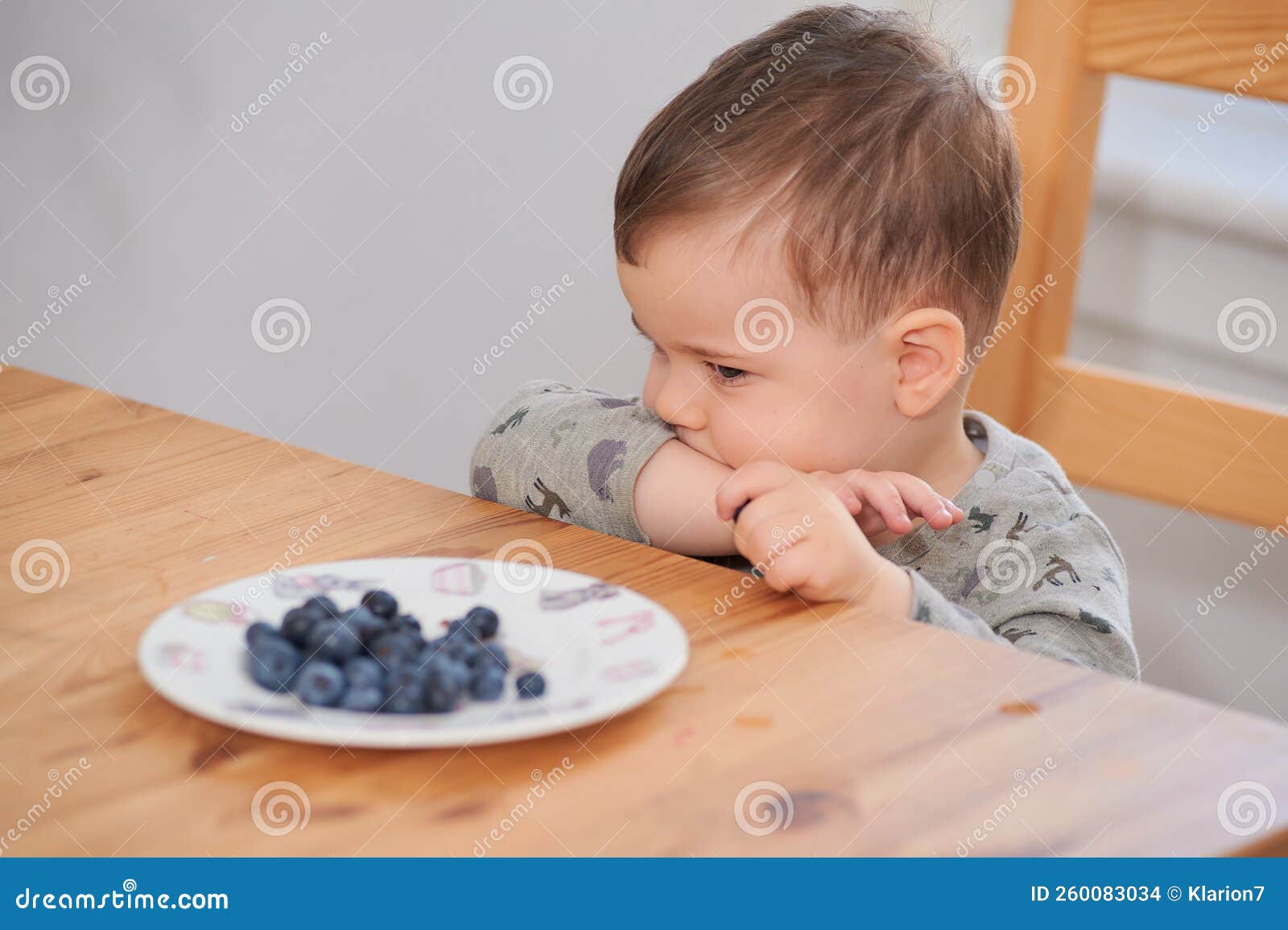 Cute Toddler Eating Blueberries Stock Photo - Image of side, toddler ...
