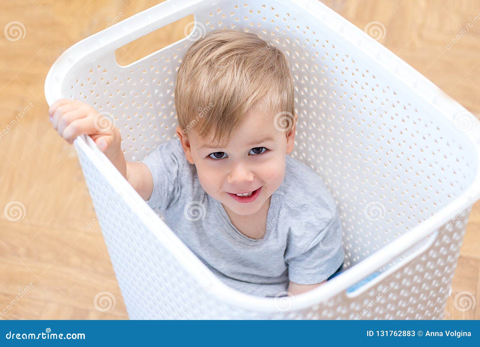 Two Year Old Boy Sitting in a Box and Playing Stock Image - Image of ...
