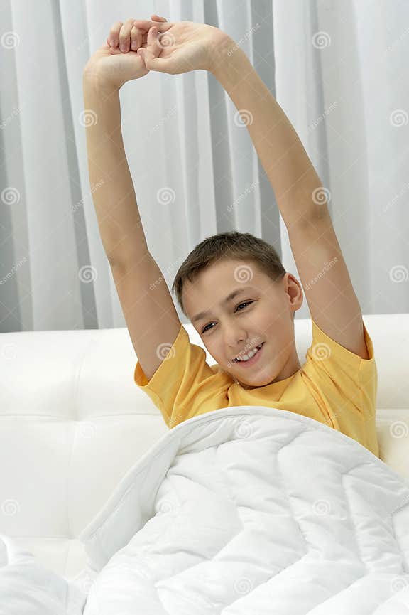 Cute waking up boy stock image. Image of comfortable - 71031989