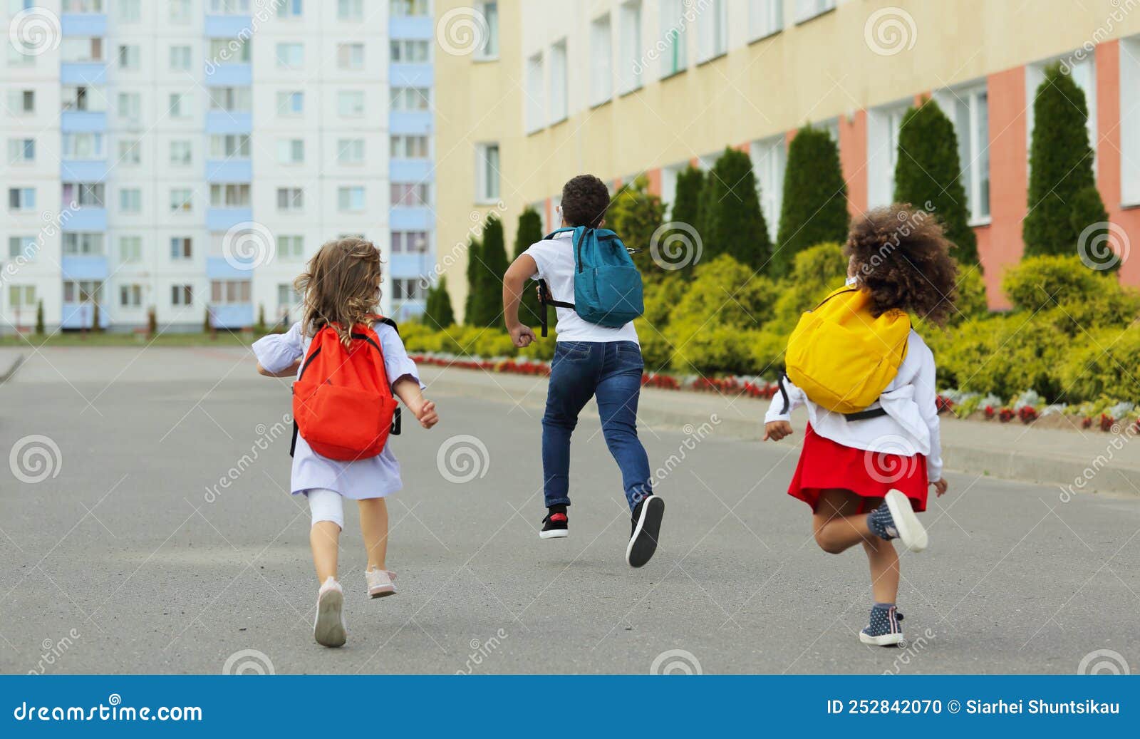 Cute White and Black Students are Running Back To School. Stock Photo ...
