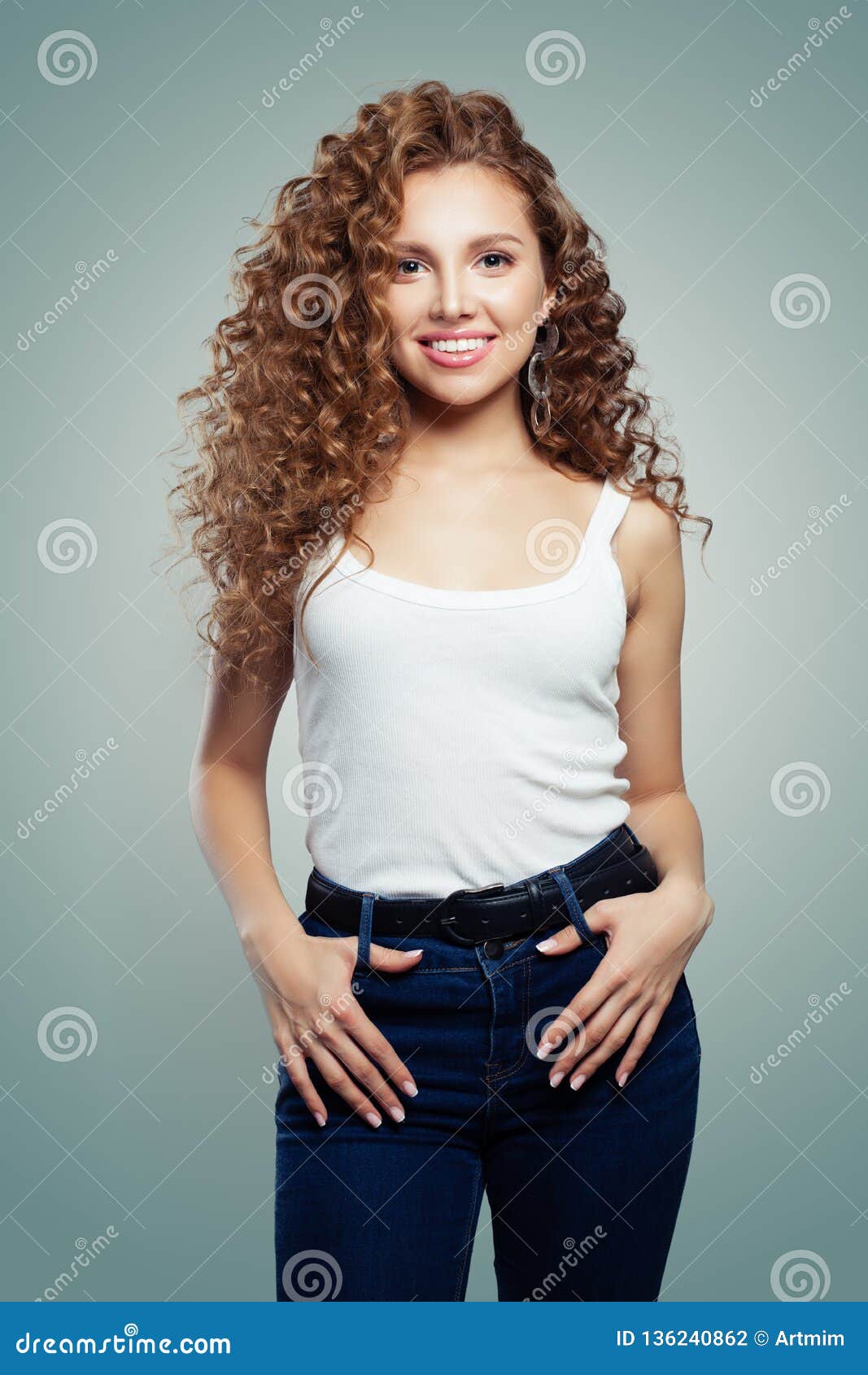 Cute woman in blue jeans stock photo. Image of lady - 136240862