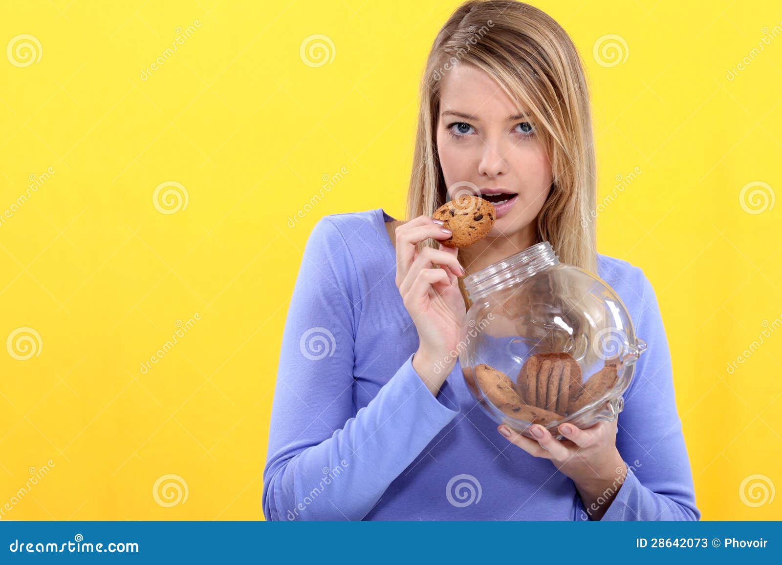 Cute woman eating cookies. stock image. Image of charming - 28642073