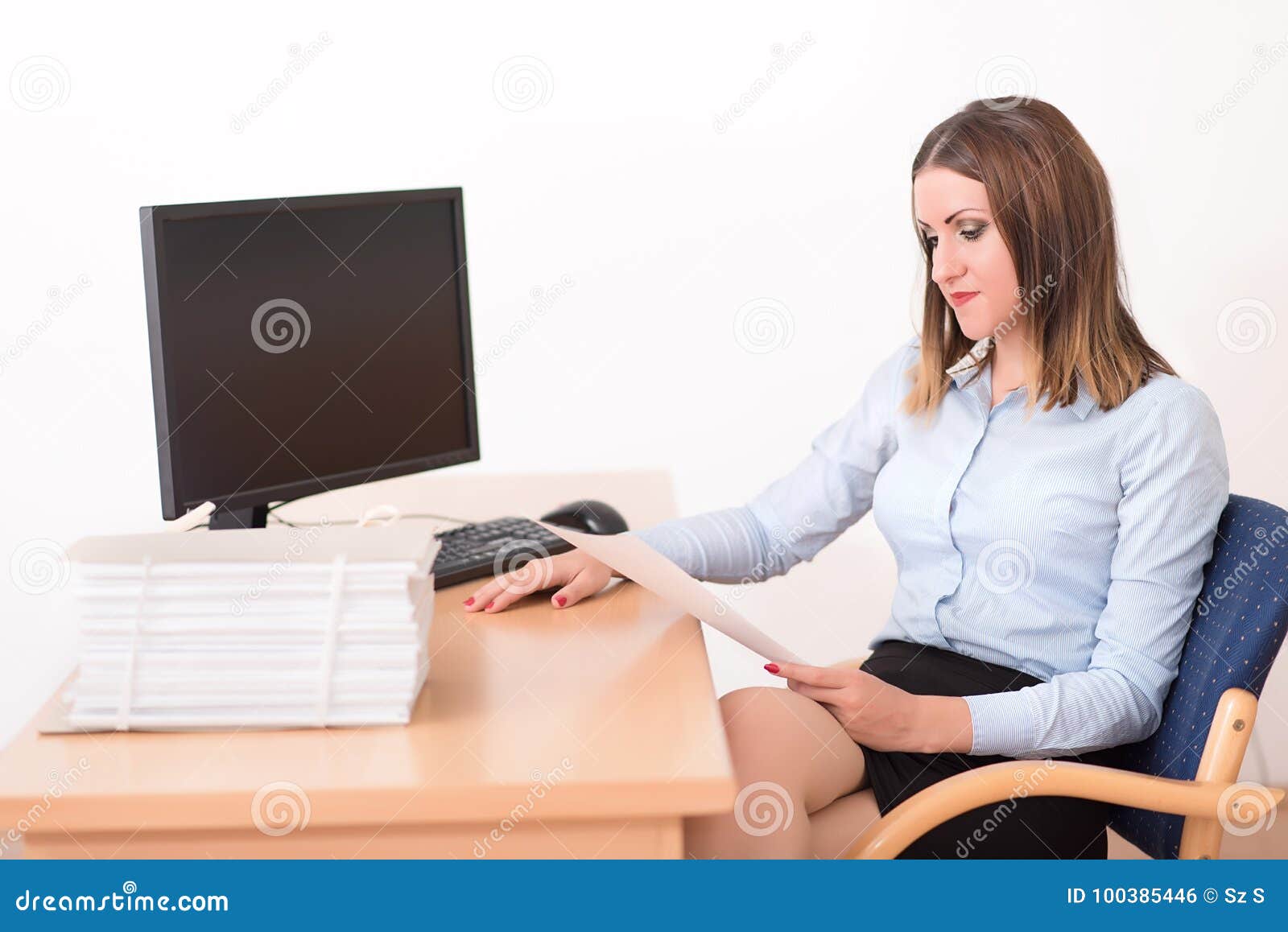 Woman Reading a Document in the Office Stock Photo - Image of ...