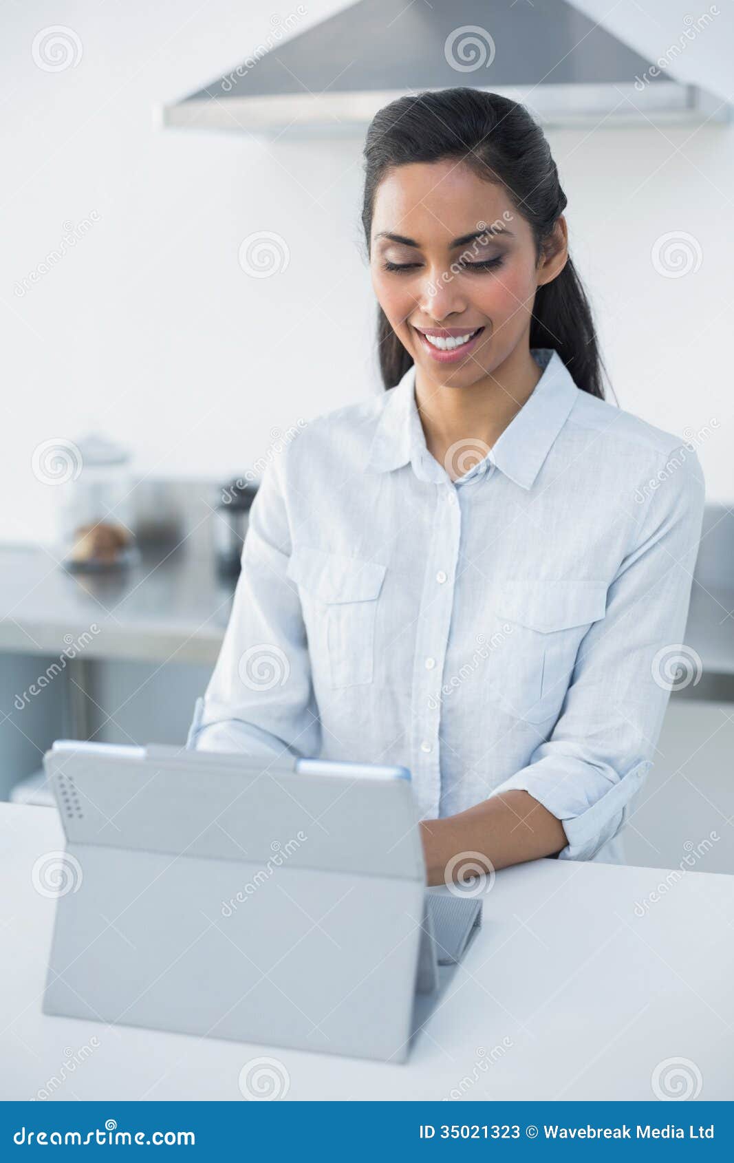 Cute Woman Using Her Tablet Standing in Bright Kitchen Stock Image ...