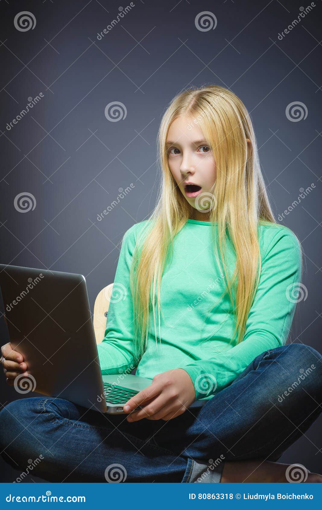 Cute Wondering Or Stressed Girl Using Laptop Isolated Grey Background