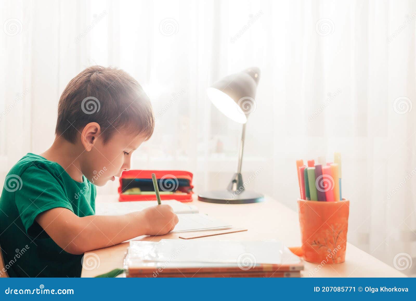 Cute 7 Years Old Child Doing His Homework Sitting by Desk Stock Image ...
