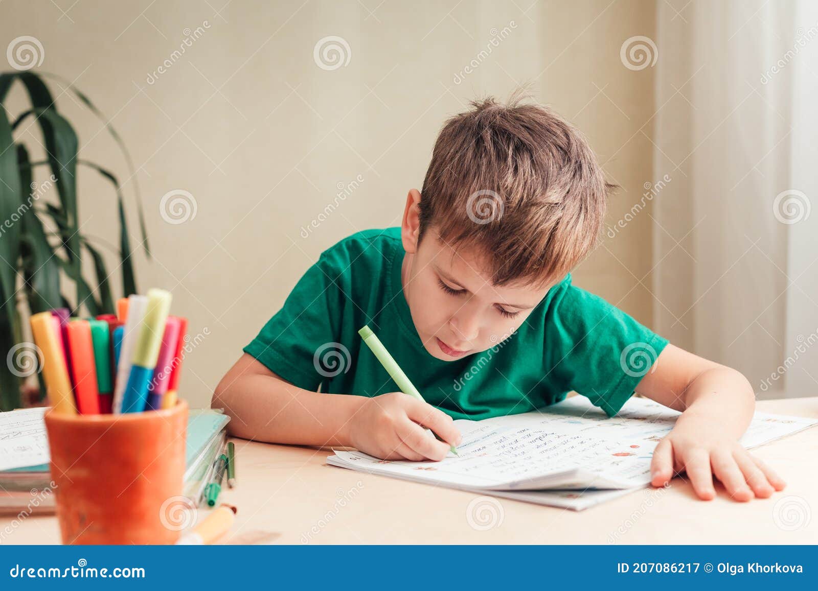Cute 7 Years Old Child Doing His Homework Sitting by Desk Stock Image ...