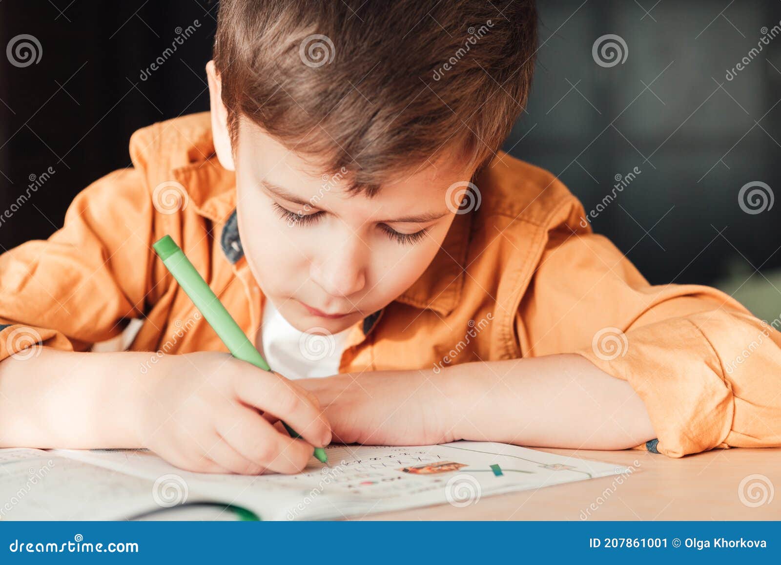 Cute 7 Years Old Child Doing His Homework Sitting by Desk Stock Image ...