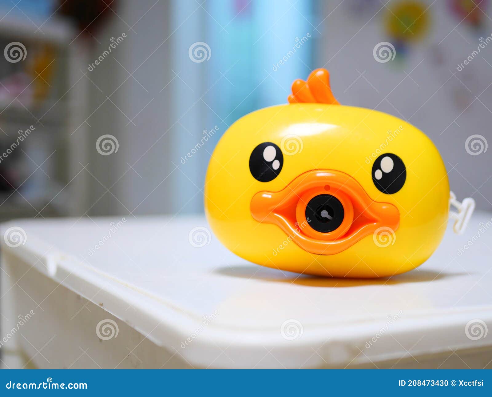 A Little Duck Bubble Machine on the Table Stock Photo - Image of warm ...