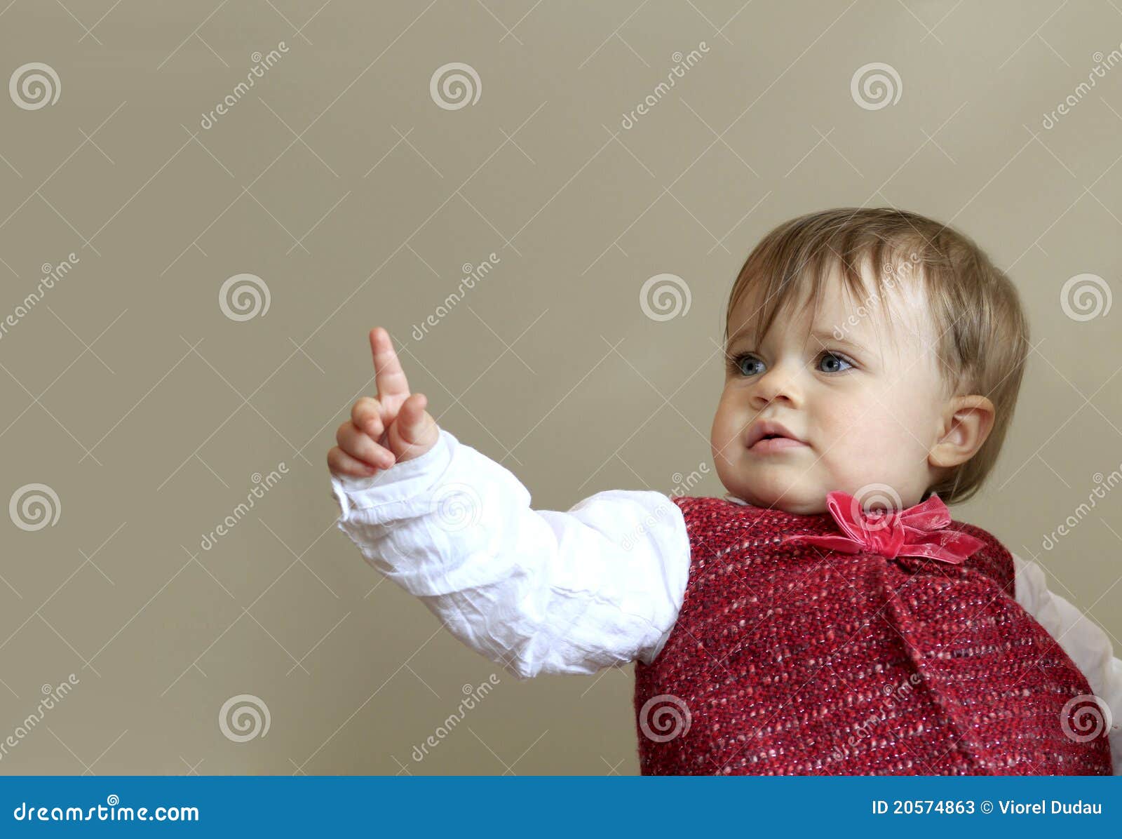 Cute Kid Pointing With His Finger On Something, Isolated On White ...