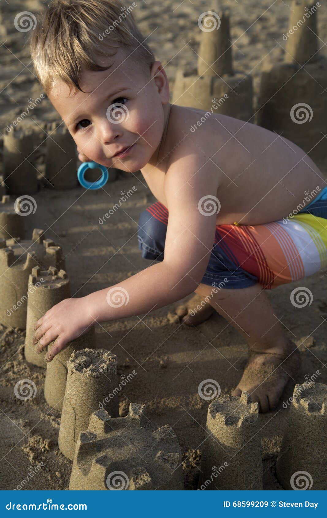 Cute Young Boy Building a Beach Sand Castle Stock Image - Image of ...