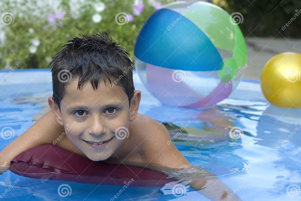 Cute young boy in pool stock photo. Image of blue, pretty - 6022848