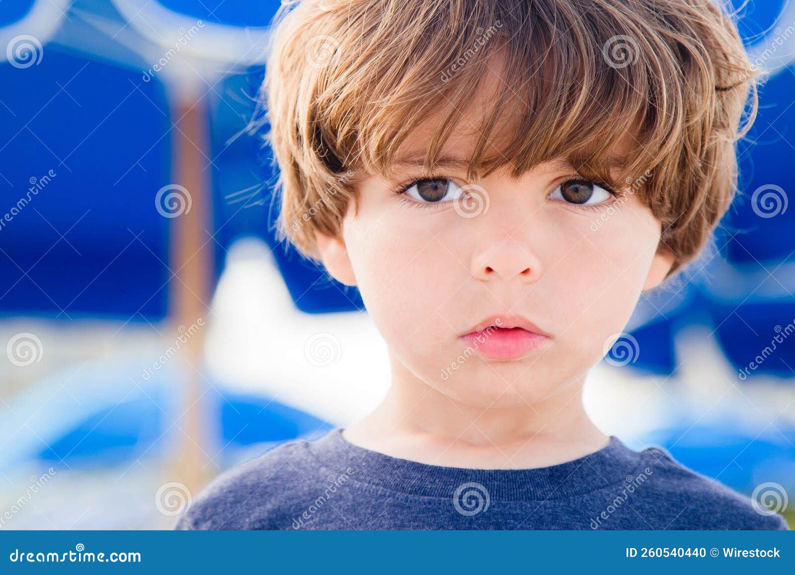 Cute Young Boy with Surprised Face Standing on the Beach Stock Photo ...