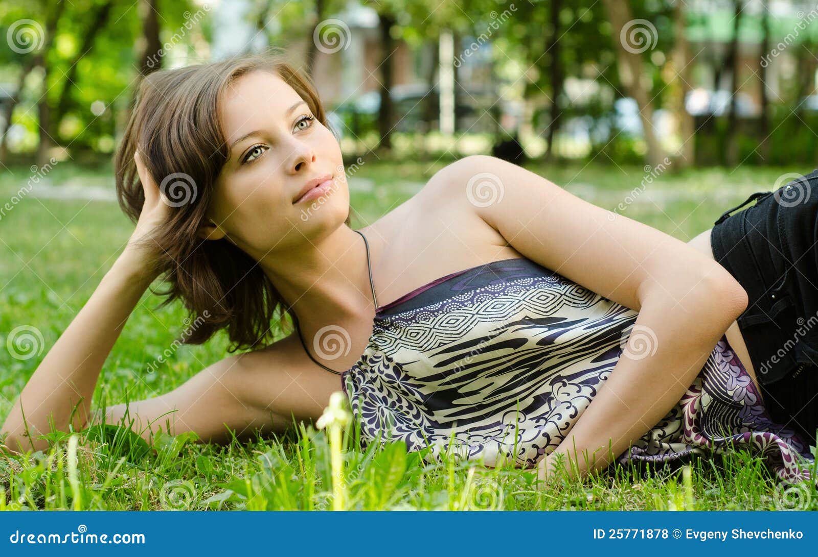 Cute Young Female Lying on Grass Field at the Park Stock Photo - Image ...