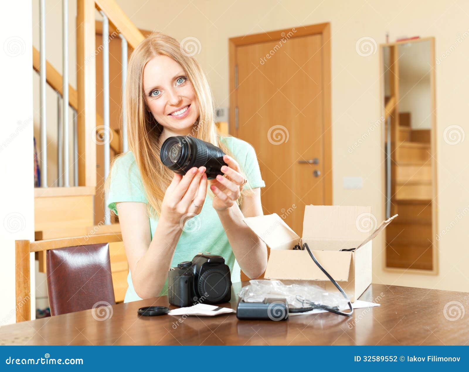 Cute Young Girl Unpacking New Digital Camera in Home Interior Stock ...