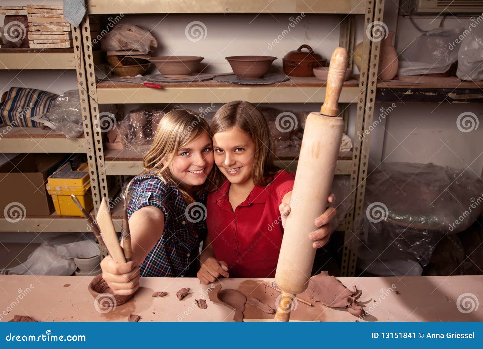 Cute Young Girls in Clay Studio Stock Image - Image of rolling, hand ...