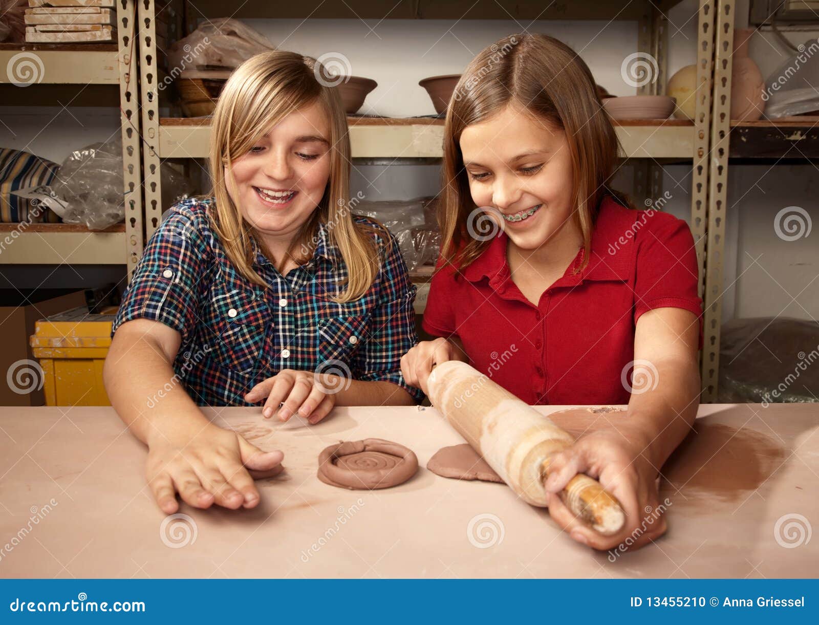 Cute Young Girls in a Clay Studio Stock Photo - Image of artist, smile ...
