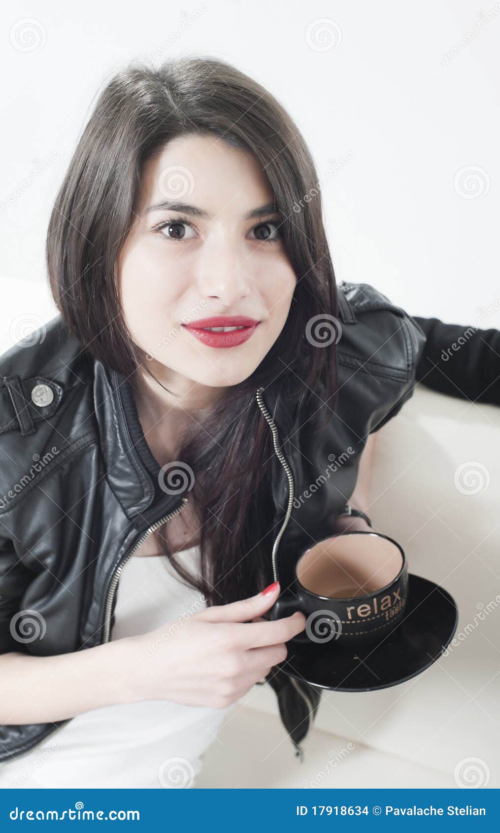 Cute Young Lady Sitting on Sofa Stock Photo - Image of house, hands ...