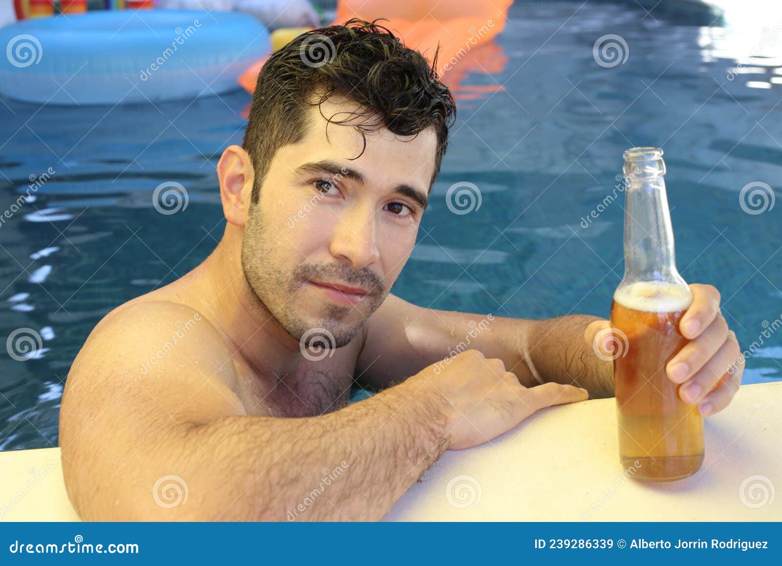 Cute Young Man Drinking a Fresh Beer in Swimming Pool Stock Image ...