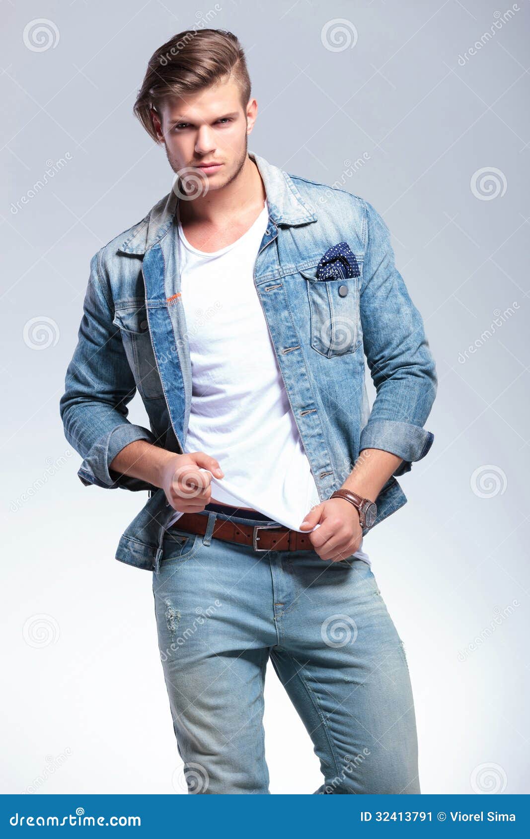 Cute Young Man Pulling His Shirt Stock Image - Image of shirt, long ...