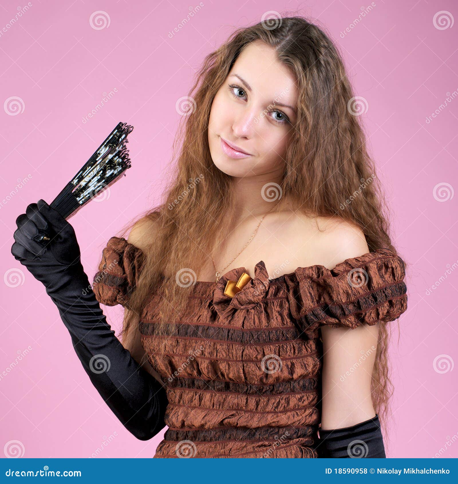 Cute young woman with fan stock photo. Image of brunette - 18590958