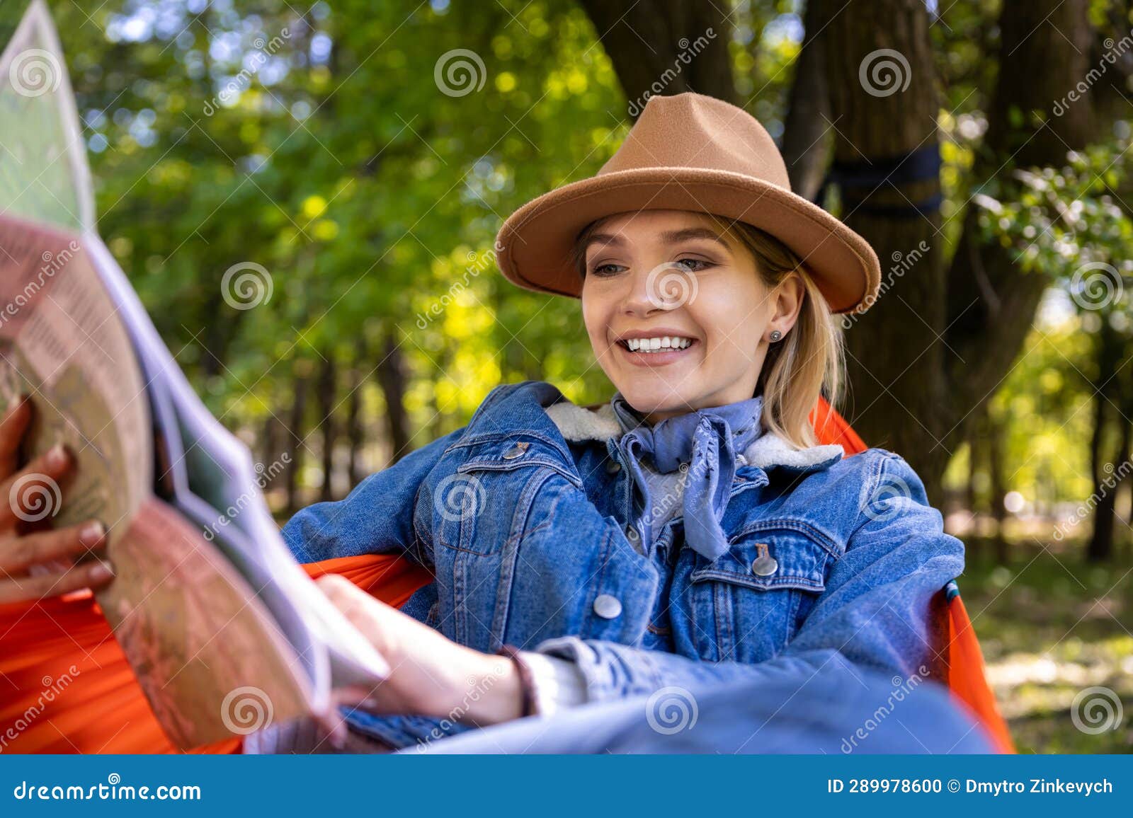 Cute Young Woman with a Map in Hands Looking for New Destination Stock ...