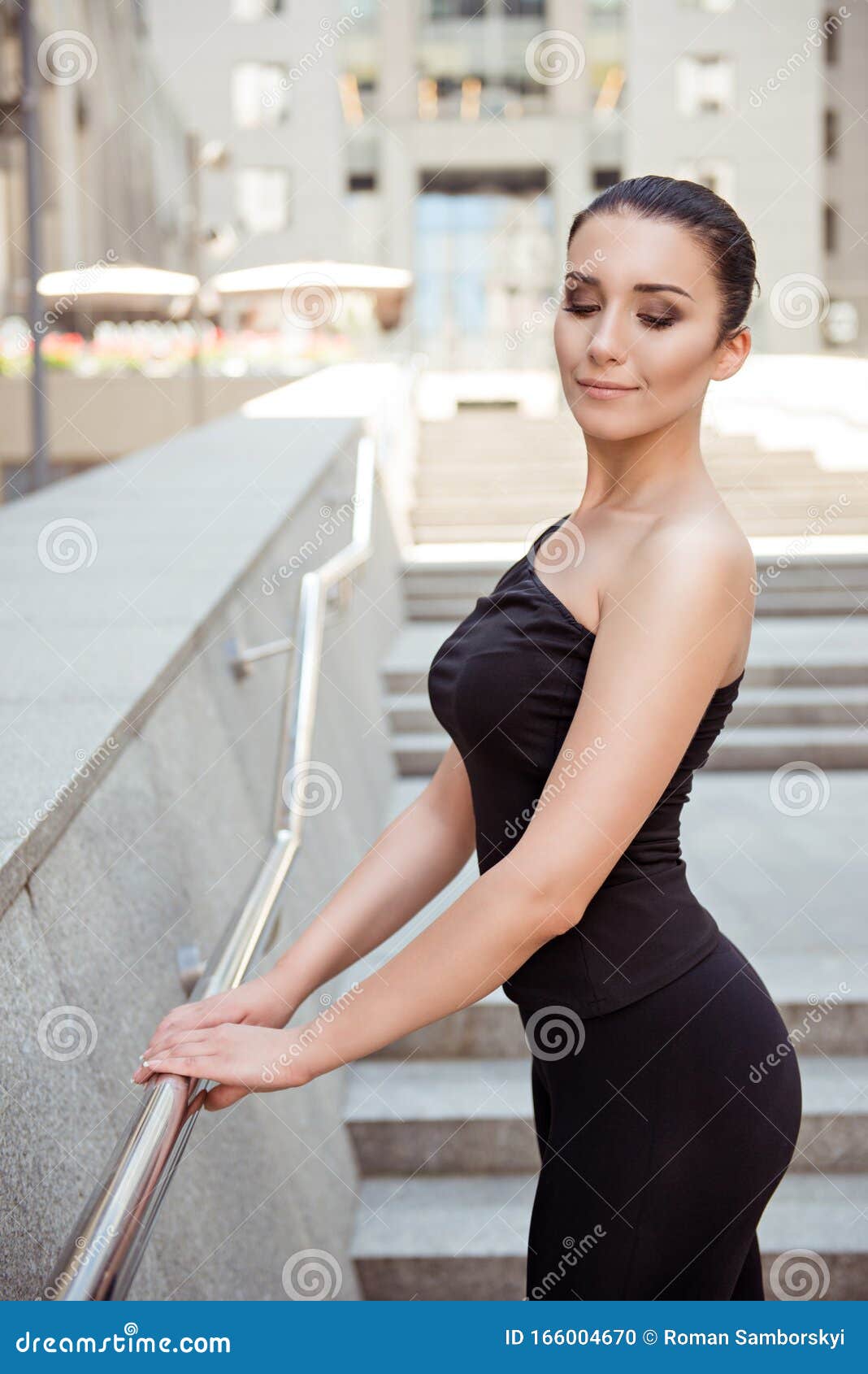 Cute Young Woman Standing at the Railing Stock Photo - Image of female ...