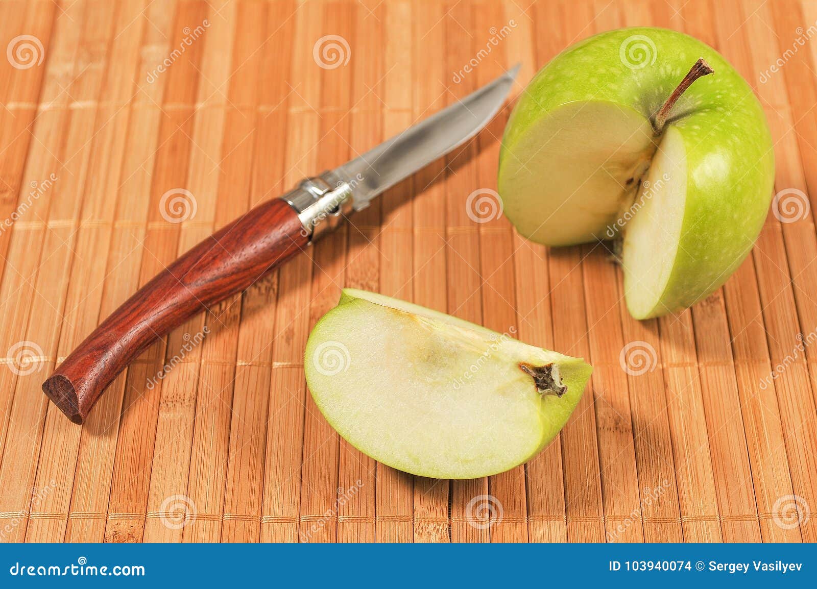Cuted Apple and Knife on Bamboo Mat Stock Photo - Image of natural ...