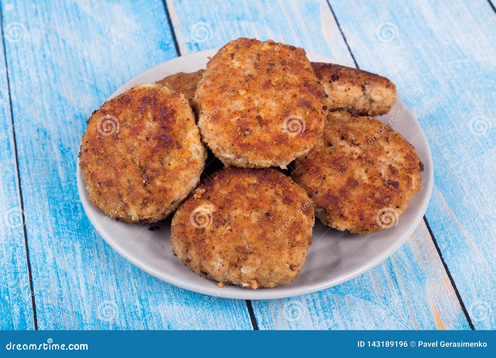Cutlets on a Grey Plate, on a Blue Wooden Background Stock Photo ...