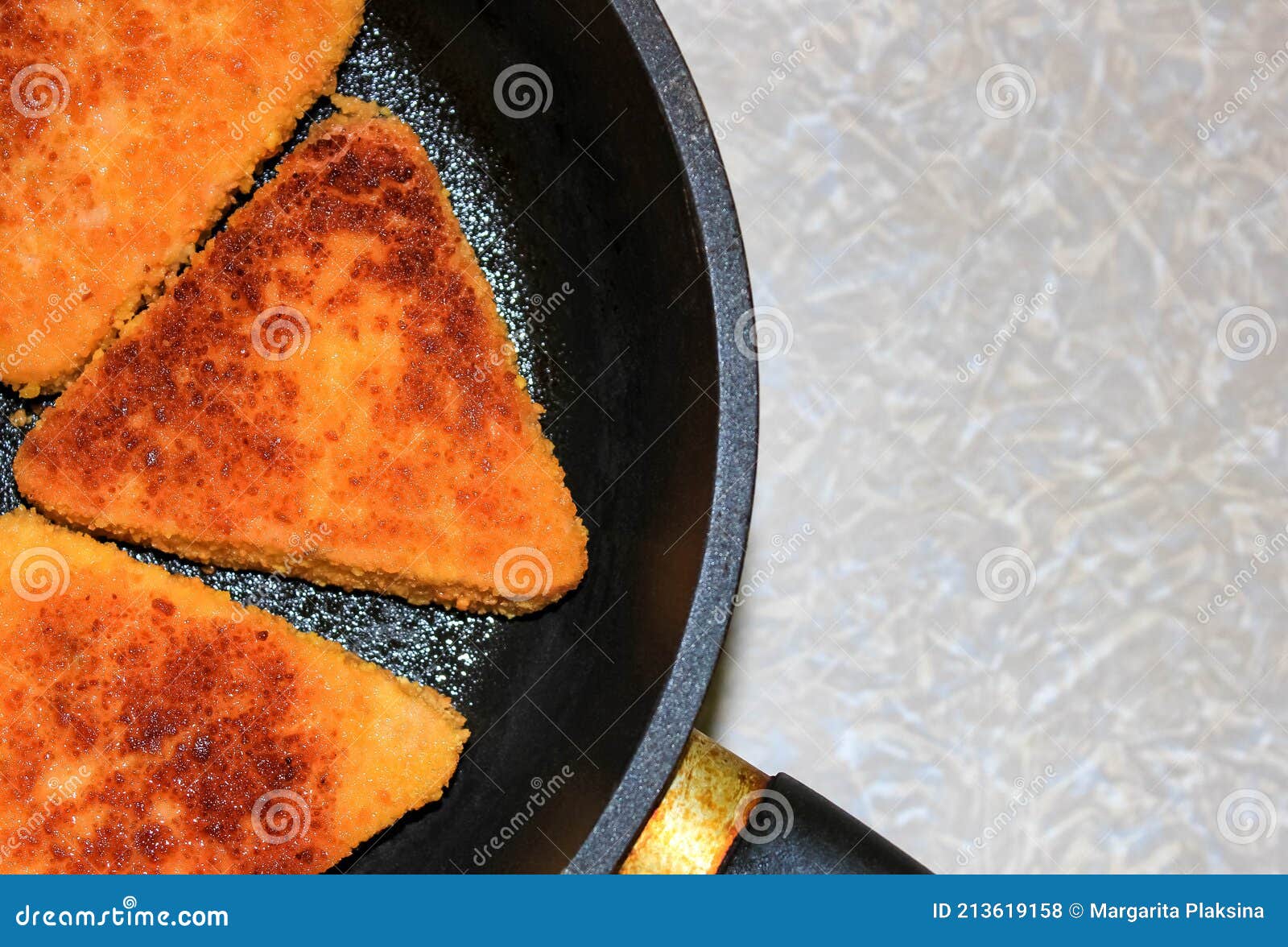 Cutlets of Triangular Shape are Fried in a Frying Pan Stock Photo ...