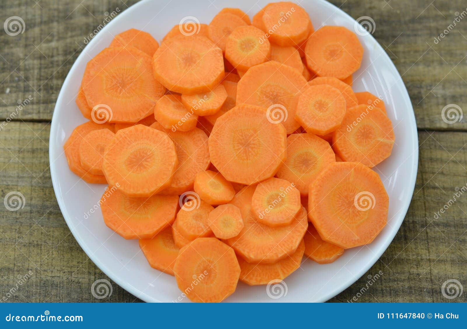 Cuts Slices of Carrot in Plate on Wooden Stock Photo - Image of color ...