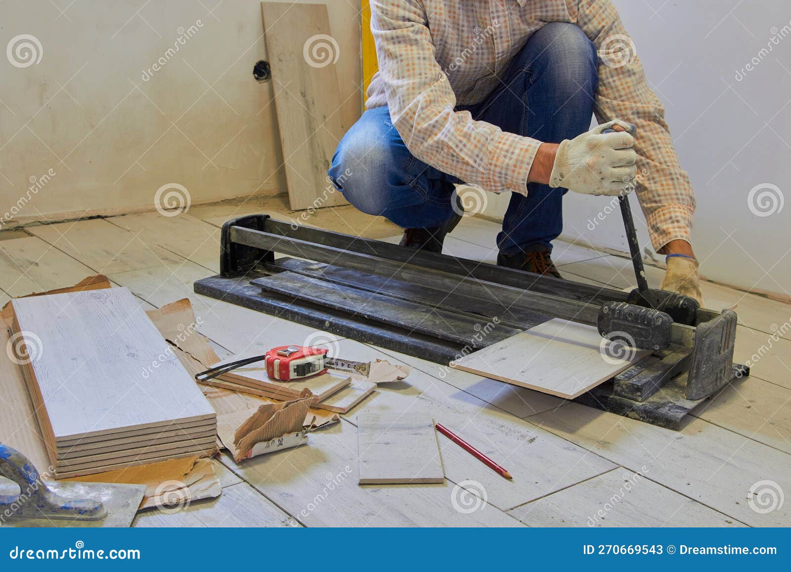 Cuts Tile Manual Cutter,the Builder Makes Repairs in the Room, Laying ... Cuts Tile Manual Cutter,the Builder Makes Repairs in the Room, Laying ...