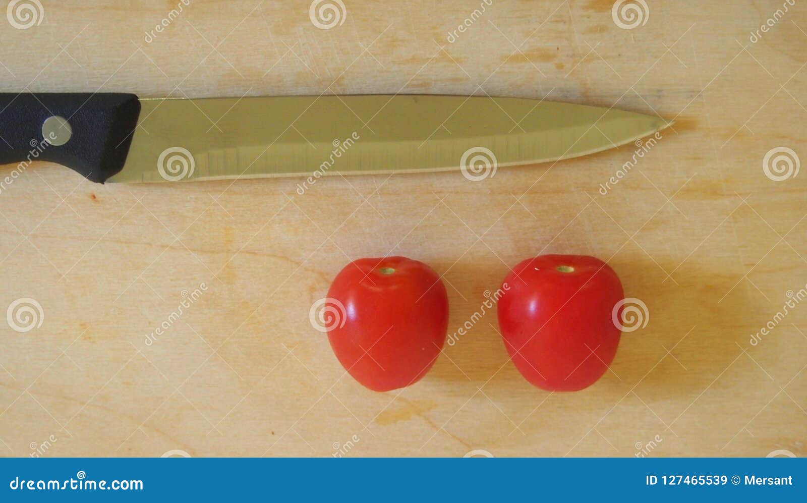 Cutted tomatoes and knife stock image. Image of eating - 127465539