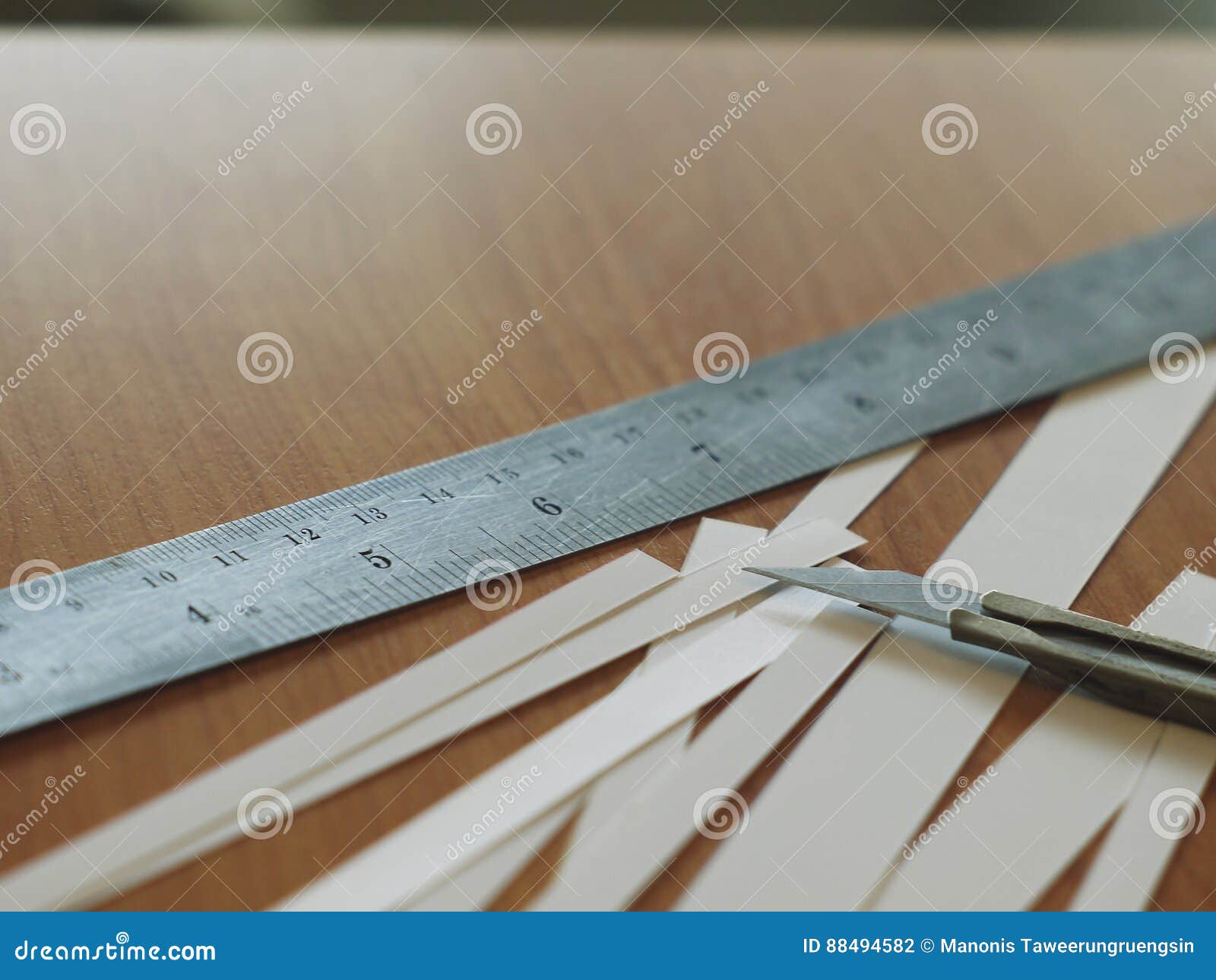 Cutter Knife with Stainless Ruler and Strip of White Paper Stock Photo ...
