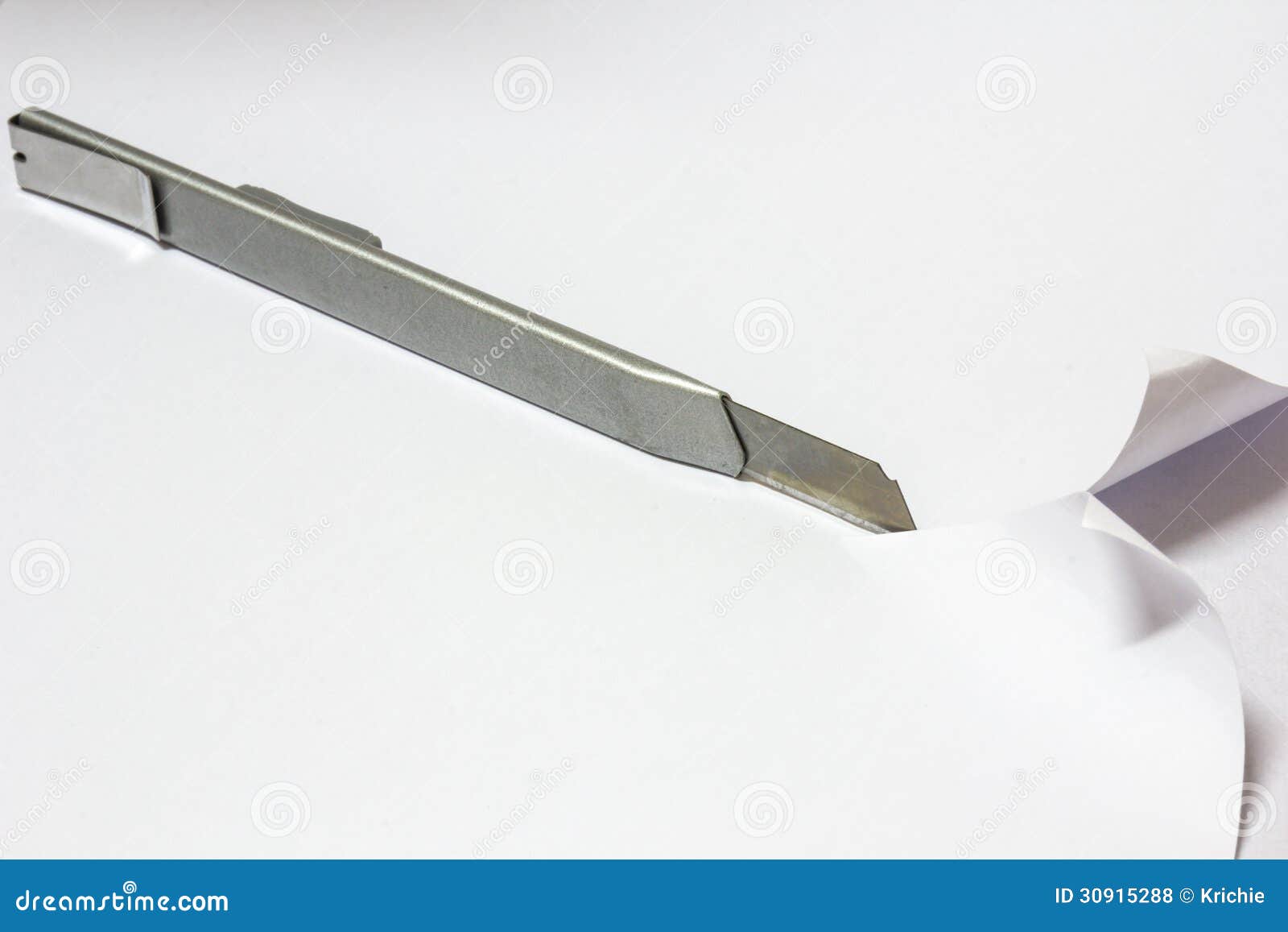 Cutter and white paper stock photo. Image of knife, artwork - 30915288
