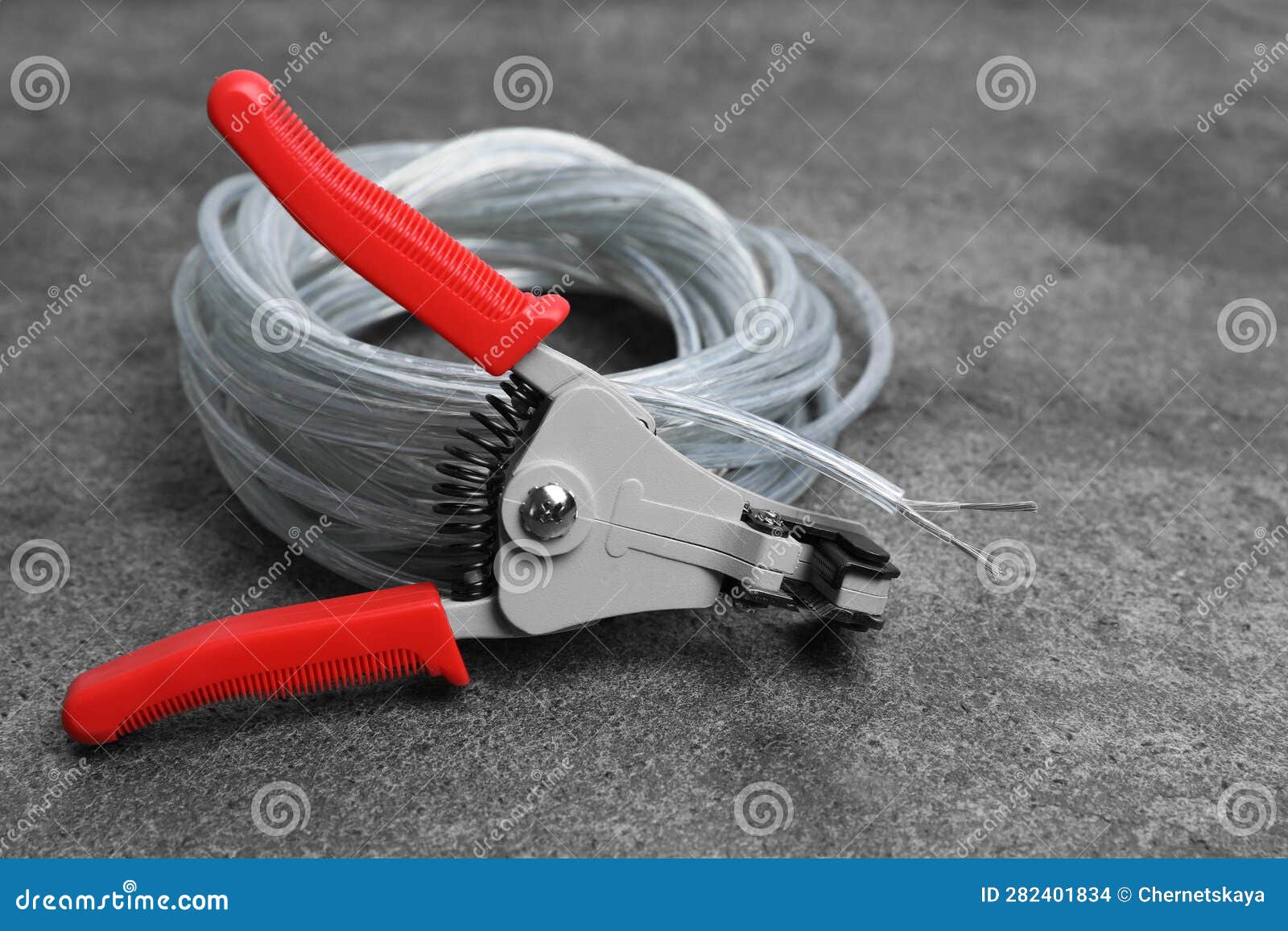 Cutters and Cable with Stripped Wire on Light Gray Textured Table Stock ...